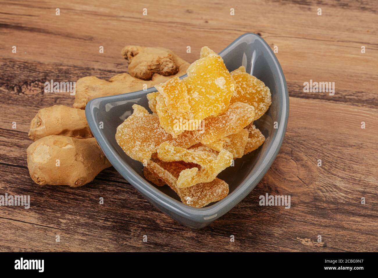 Dry sweet ginger snack in the bowl Stock Photo - Alamy