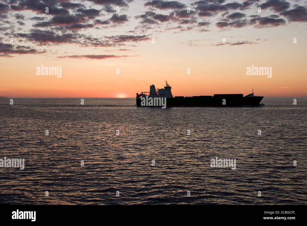 Ship on sunset in the North Sea Stock Photo - Alamy