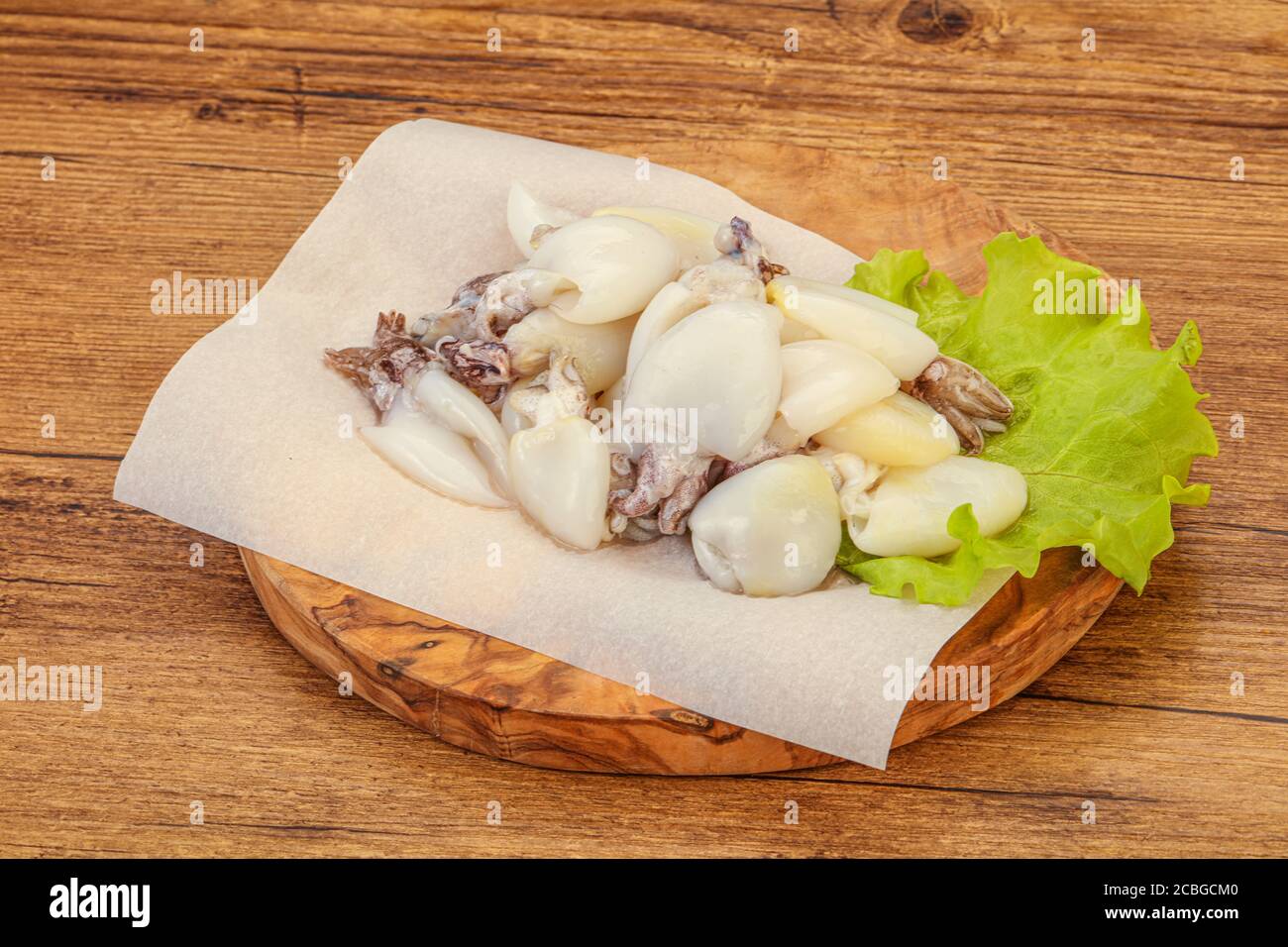 Raw seafood - cuttlefish for cooking over board Stock Photo - Alamy