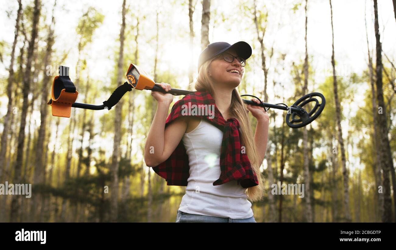 Woman with metal detector hi-res stock photography and images - Alamy