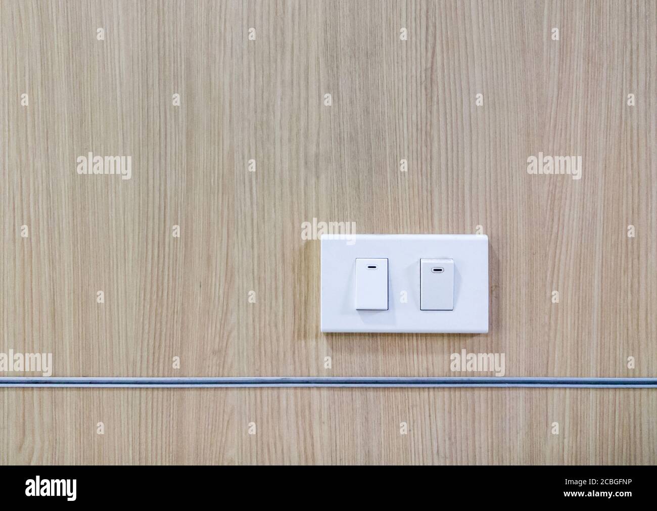Modern light switch (plastic frame) is turned on and turned off on the ...