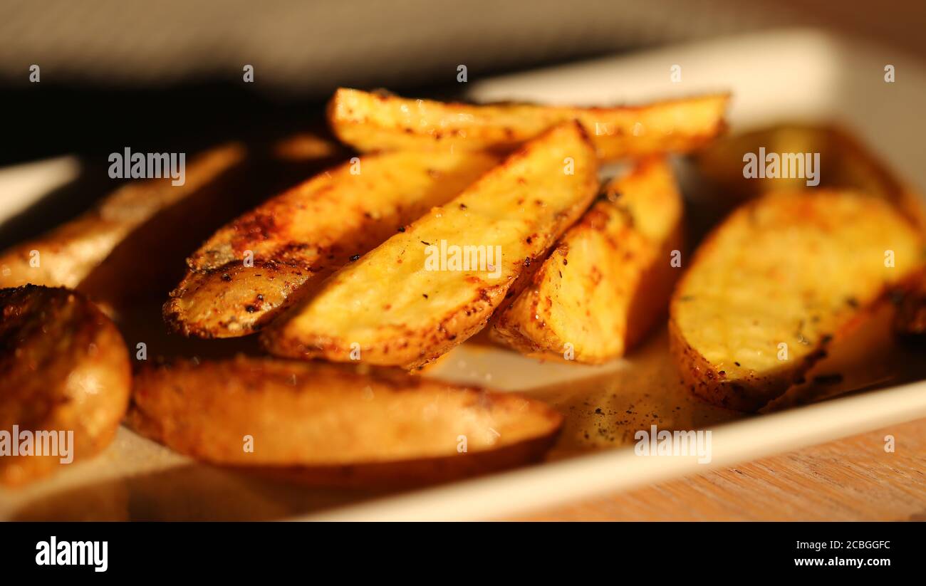 Photo macro of delicious baked potatoes on a plate. Poster for ...