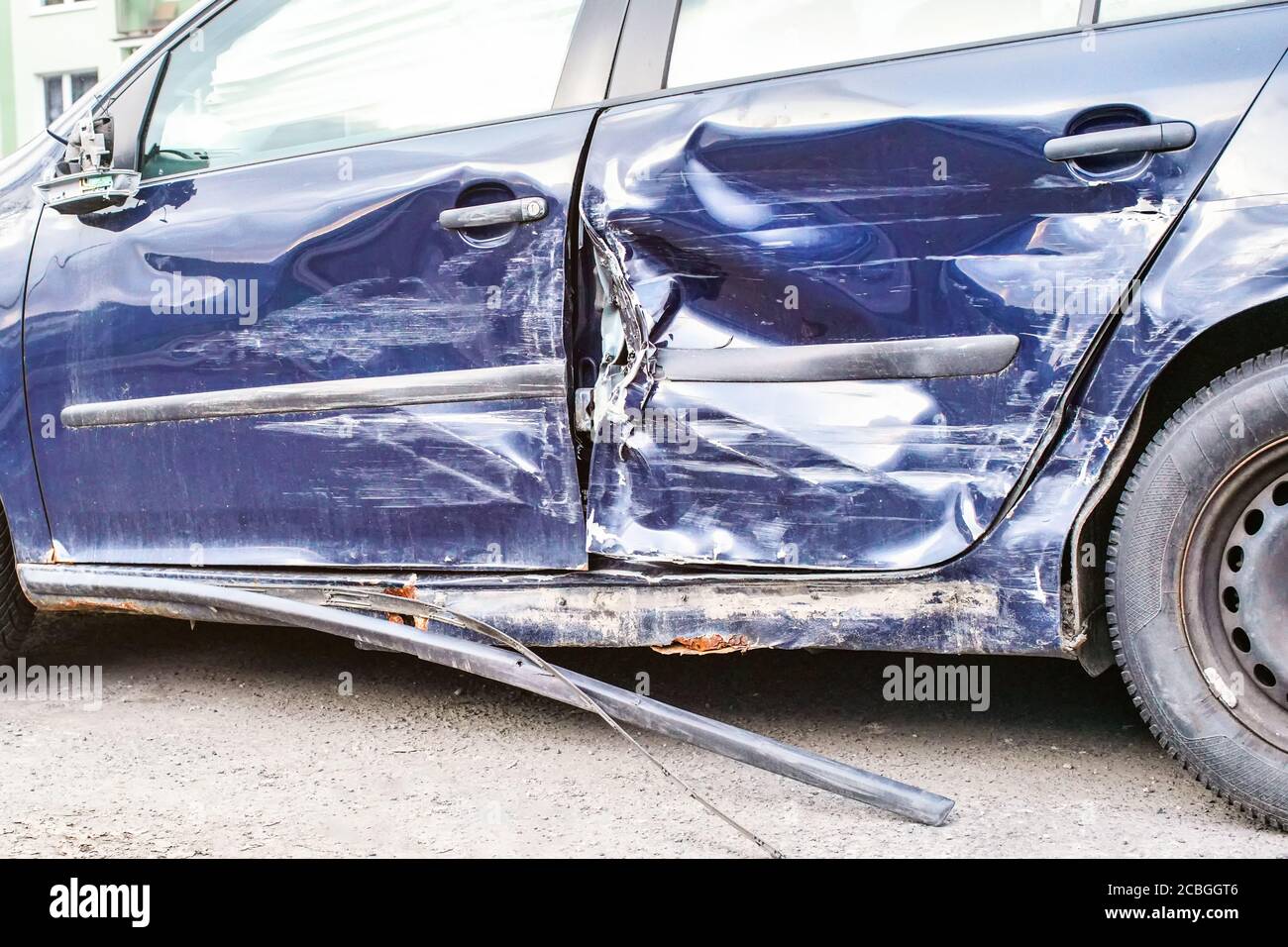 Crashed car, detail on side - metal plates deformed after accident hit ...