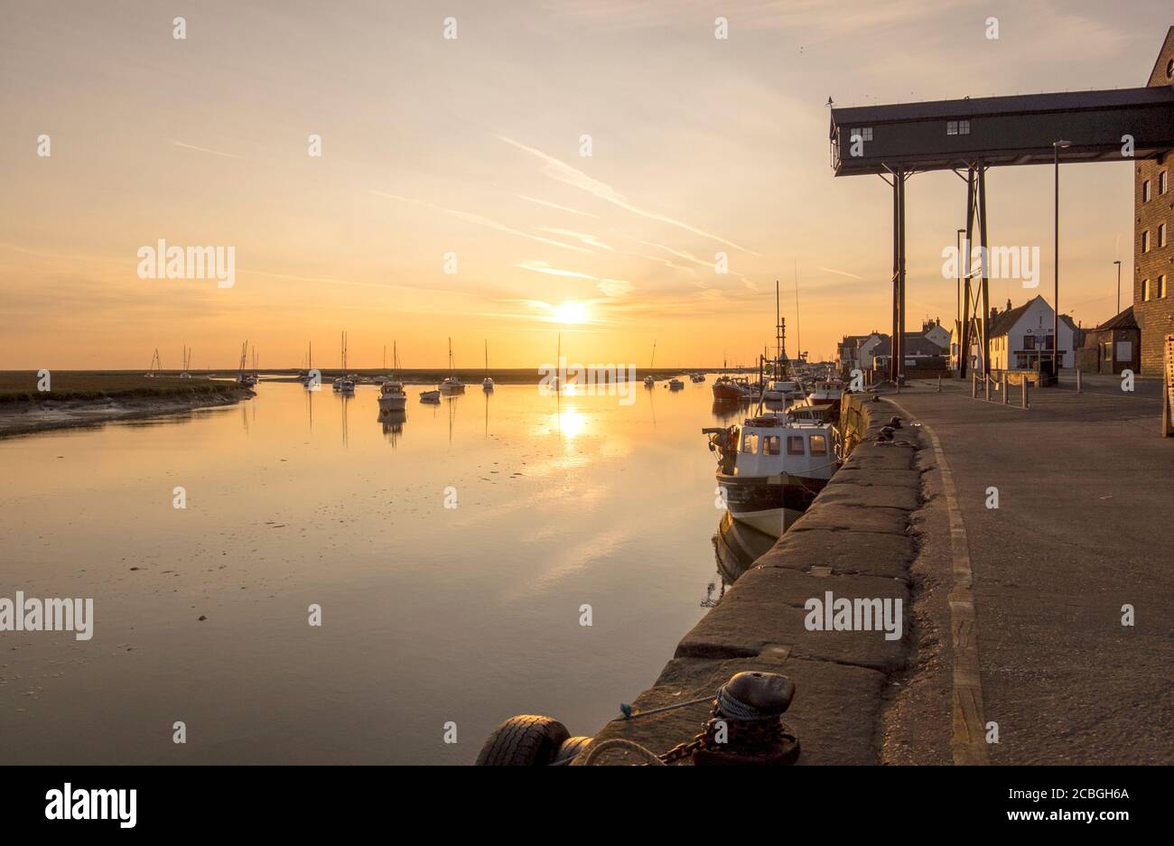 Harbour sunrise scene Stock Photo - Alamy