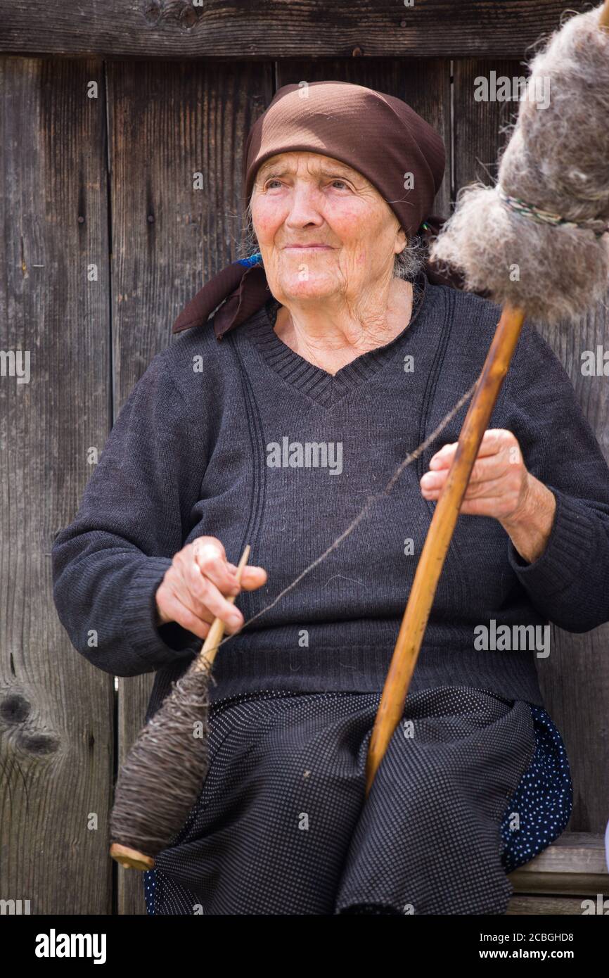 Maramures, Romania-June 14 2018 : A old smiling woman with a spindle ...