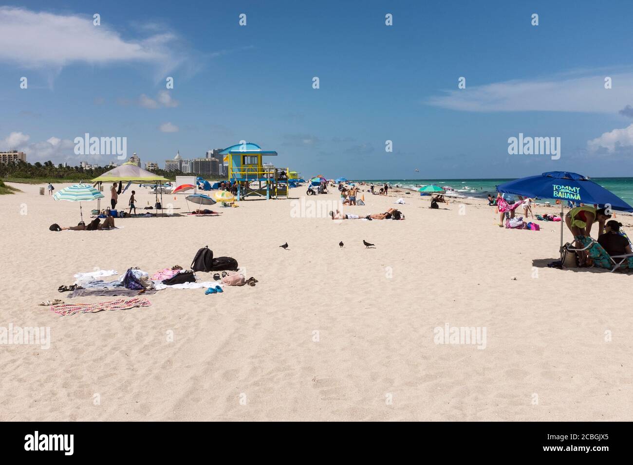 People enjoying a day on the beach, at South Beach, Miami Beach ...