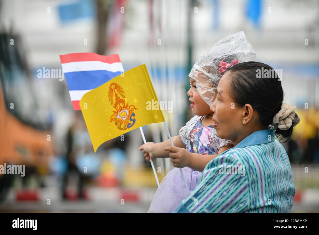 Thai well-wishers gather at the Grand Palace wall as they attend the ...