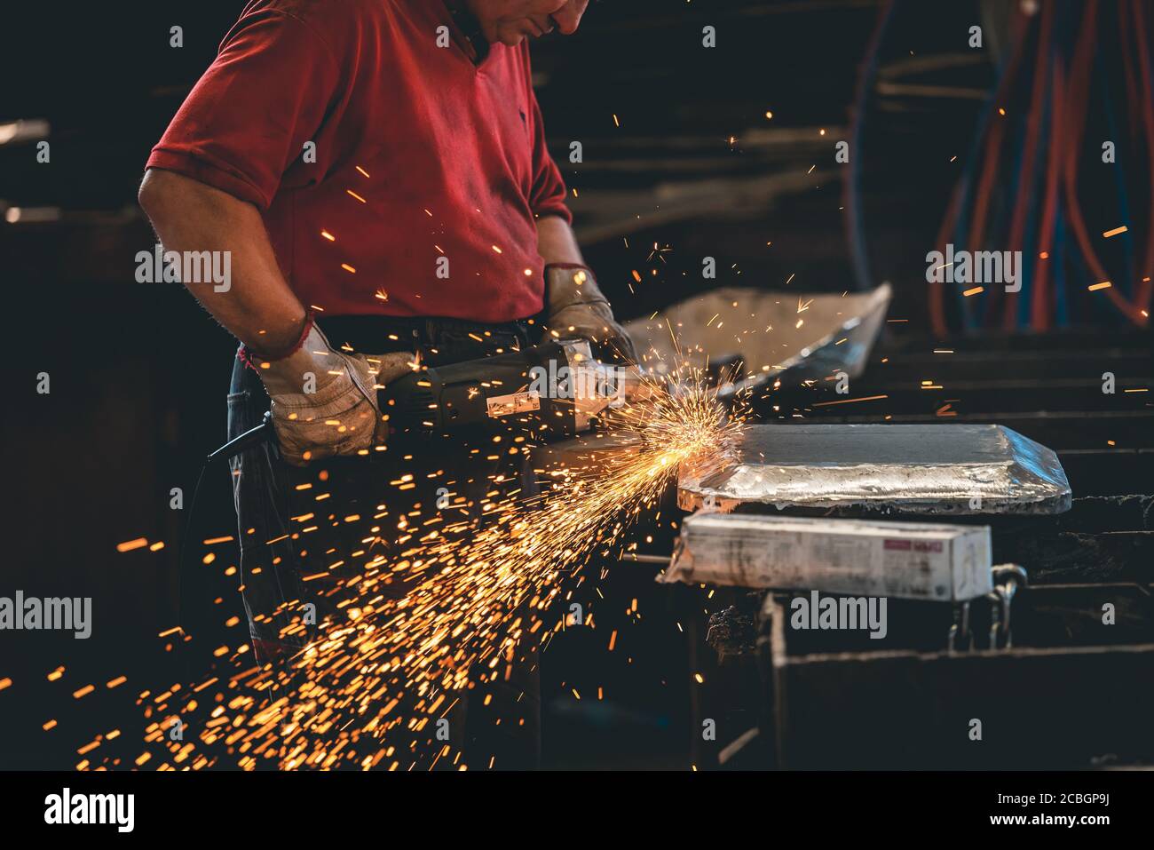 Hands of workers grinding steel in the metal industry Stock Photo - Alamy