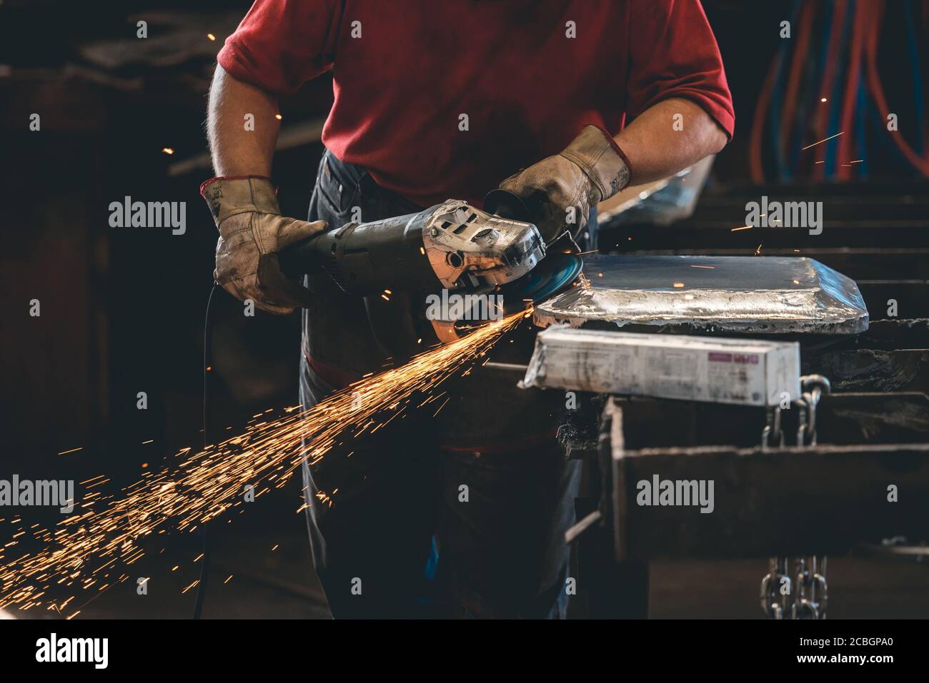 Hands of workers grinding steel in the metal industry Stock Photo - Alamy