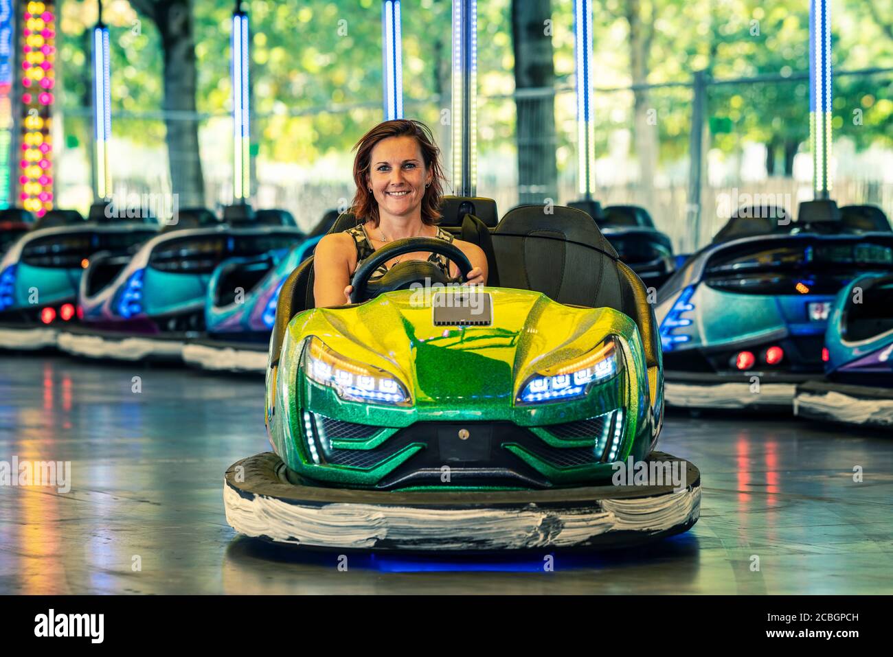 Woman in a bumper car, Paris, France Stock Photo - Alamy