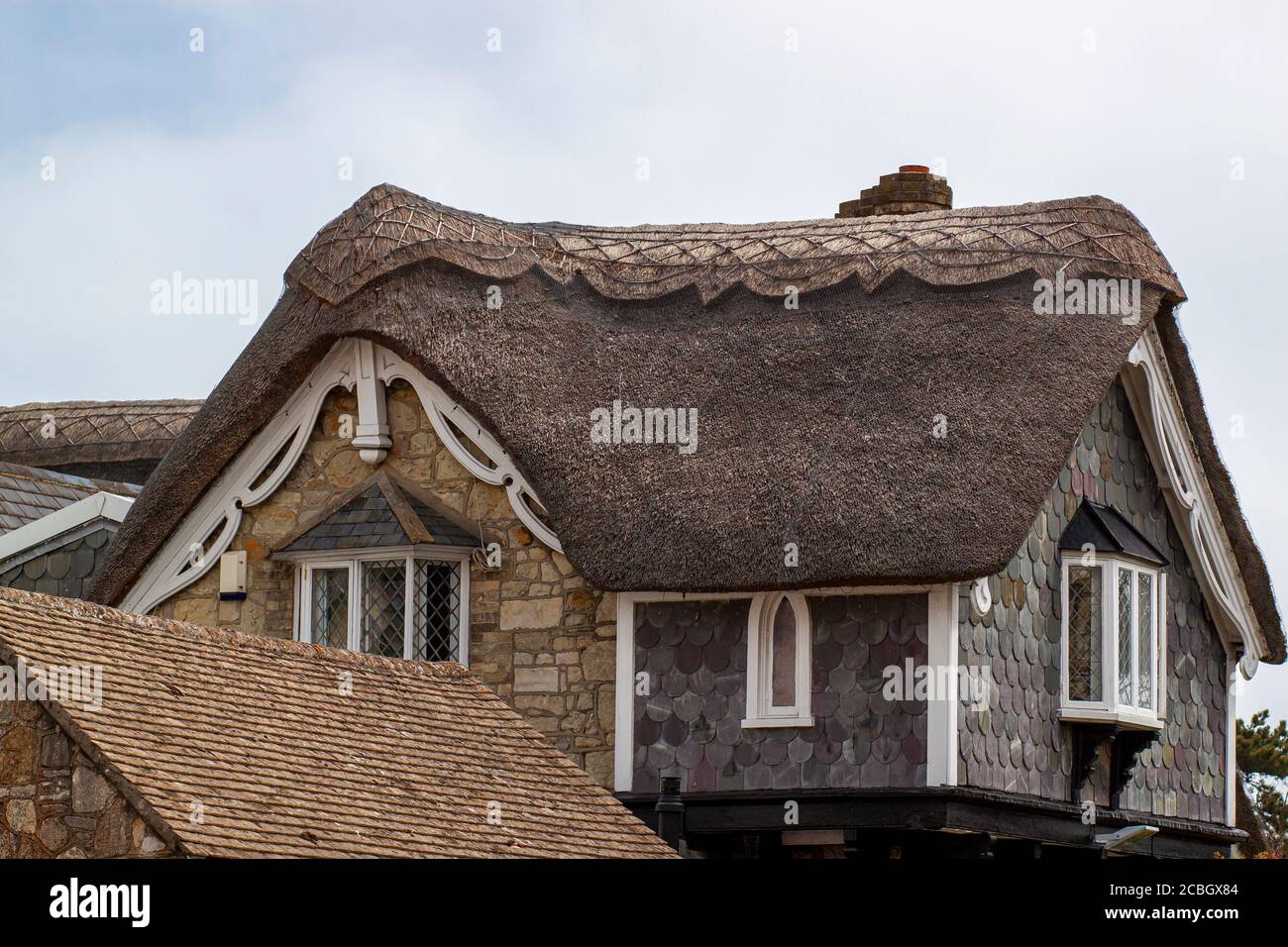 Close up image of a vintage house with thatched roofs. These ...