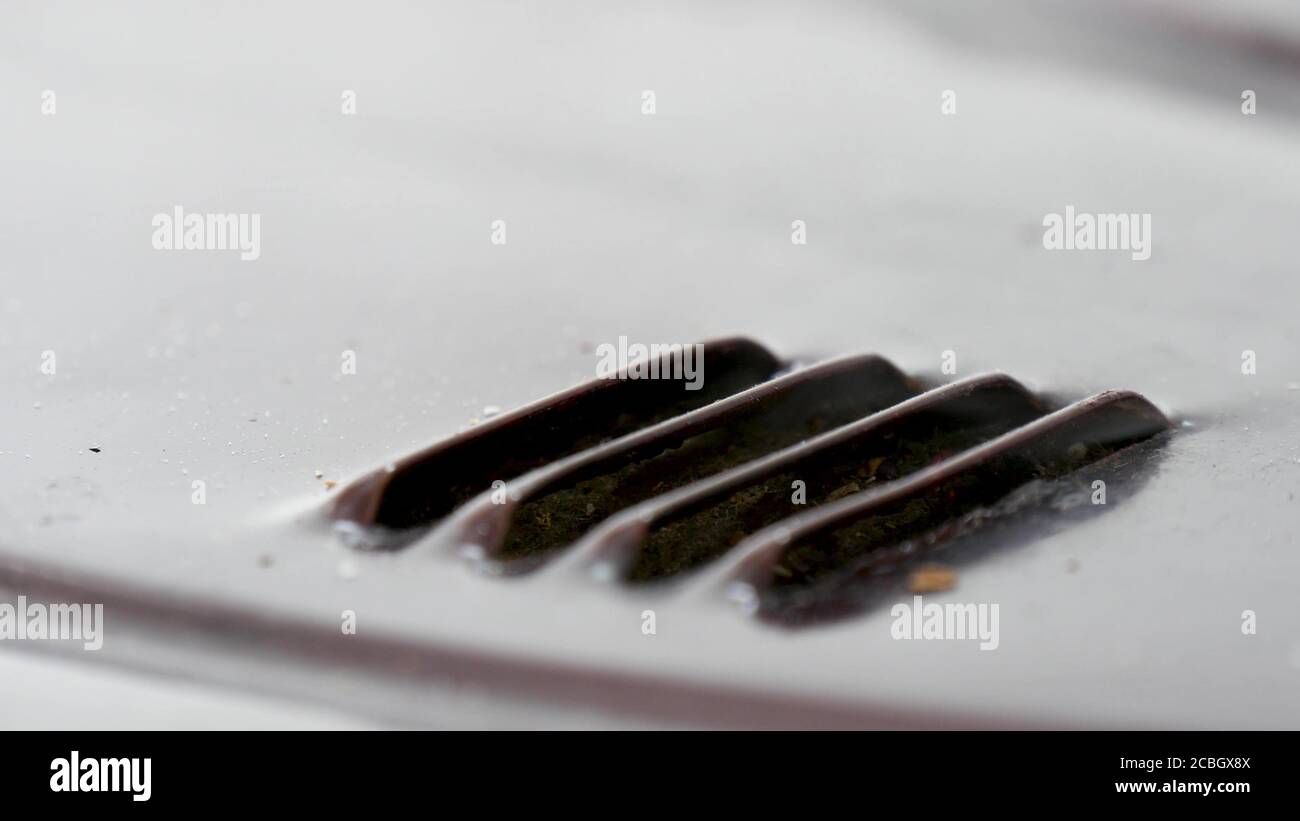 Vent hole with steam on the sheet metal Closeup view Stock Photo - Alamy