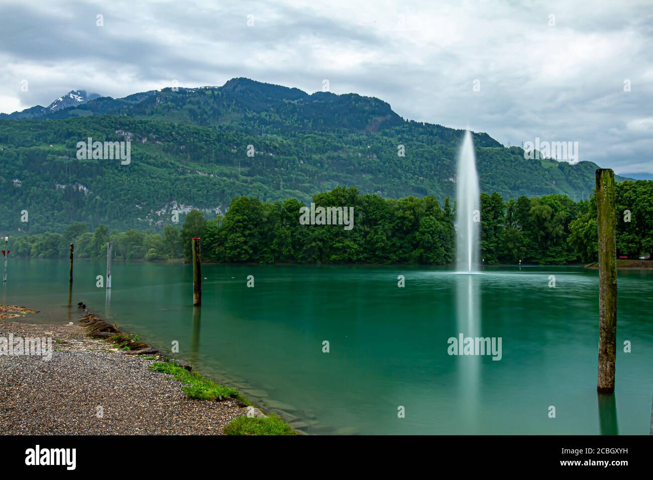 Landscape photo of a mountain lake amongst Swiss Alps. The long ...