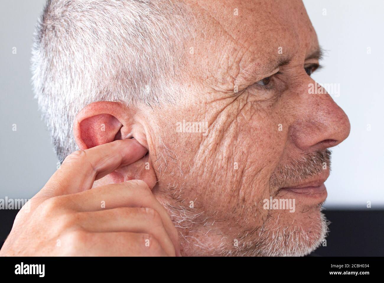 Ear picking finger hi-res stock photography and images - Alamy