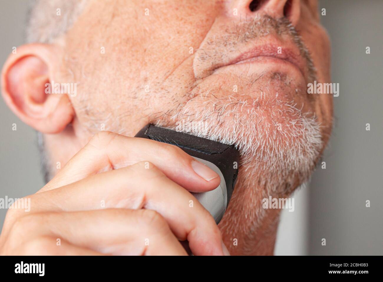 Man with untrimmed beard hi-res stock photography and images - Alamy