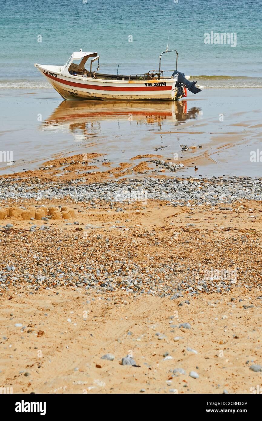 Fishing boat stranded on beach hi-res stock photography and images - Alamy
