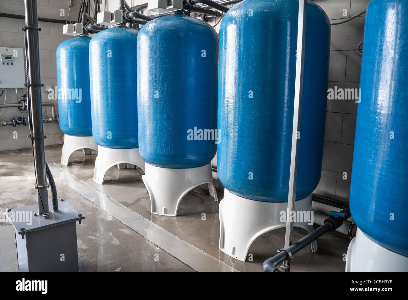 Water factory production, industrial interior. Large metal tanks for ...