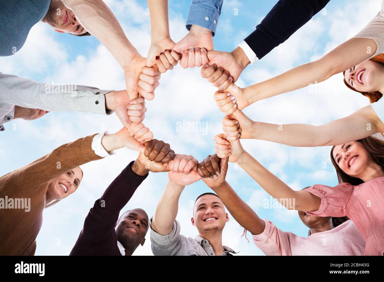 Multicultural And Multi Racial Huddle. Team Or Group Of People Stock ...