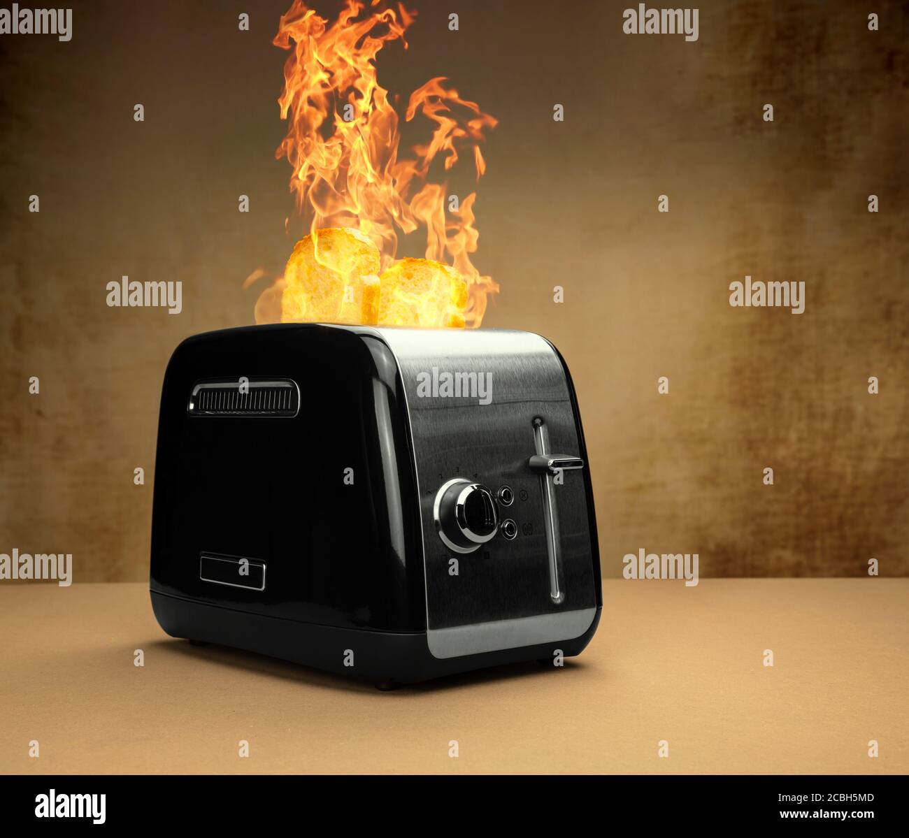 burning black silver toaster with big burning flames on top with baked ...