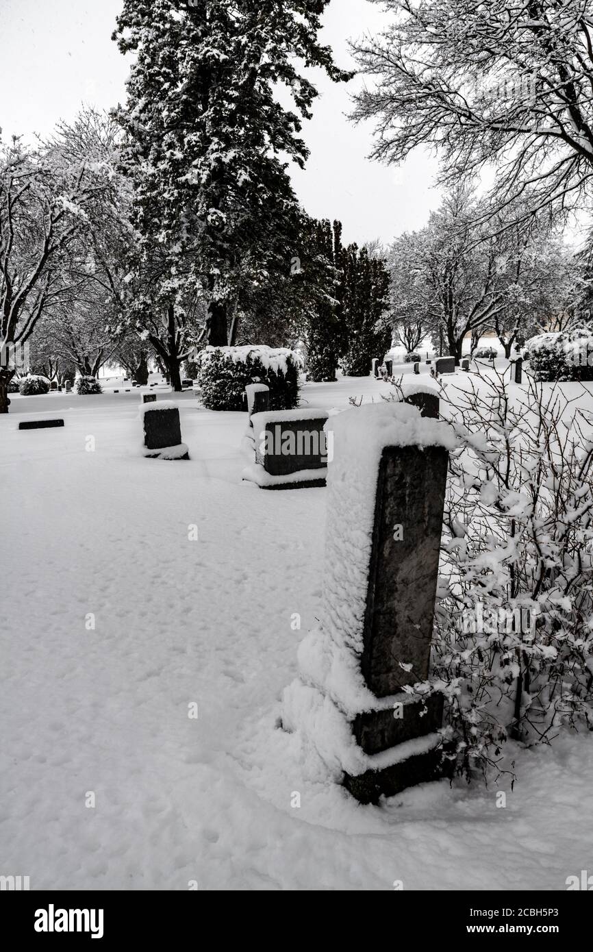 Snow Covered Cemetery in Deep Winter Stock Photo - Alamy