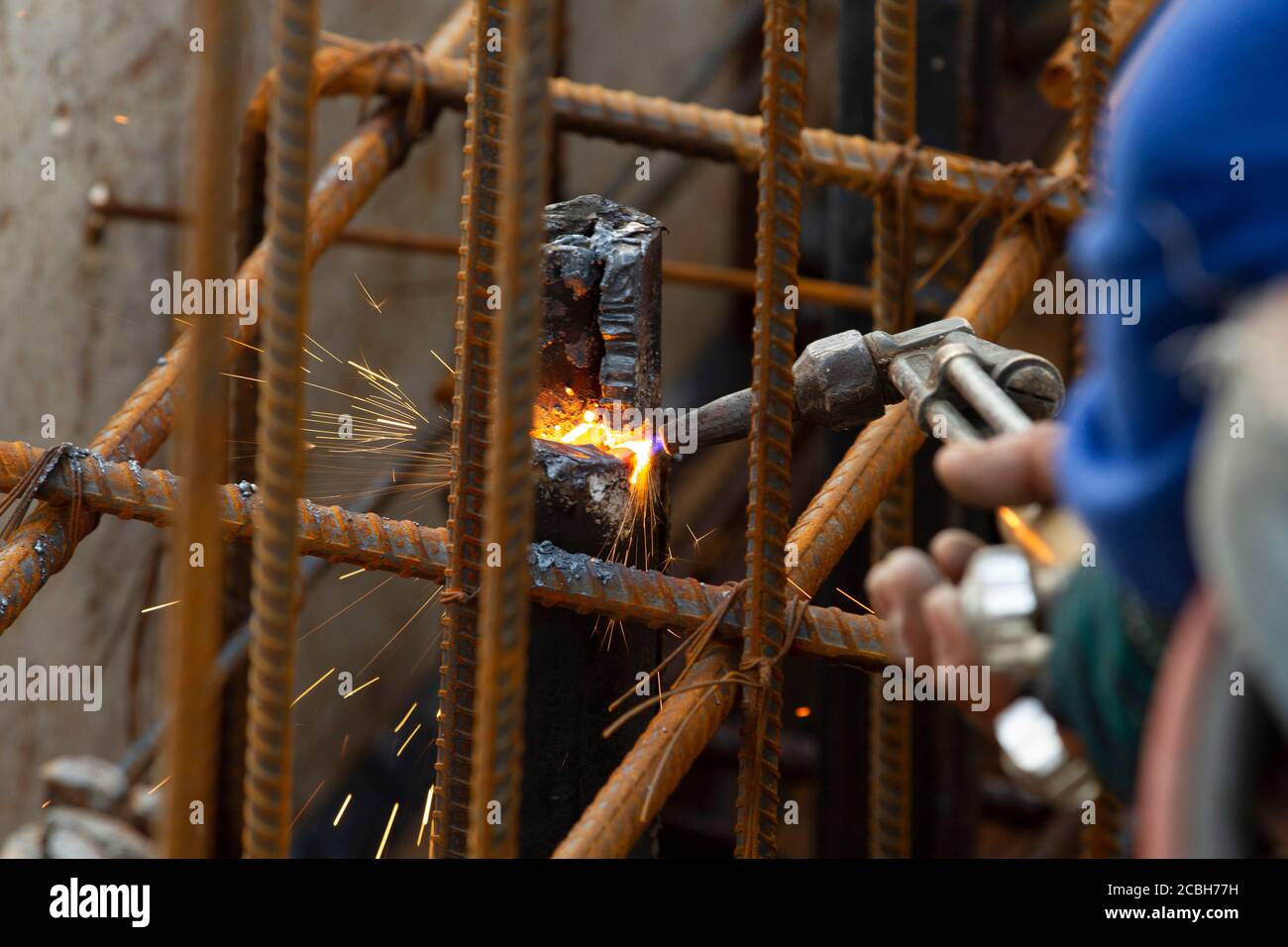 Welder worker during perform cutting steel with fire sparks Stock Photo ...