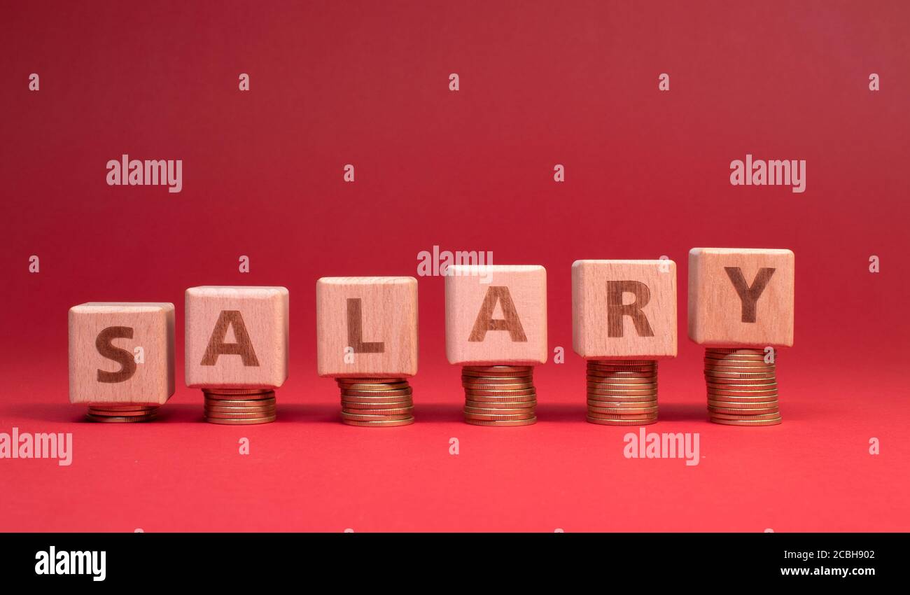 Salary word made with wooden blocks with stacked coins: Growing salary ...