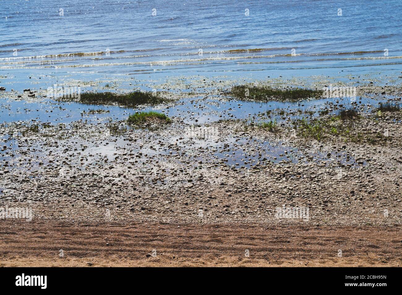 Shore of the sea. seascape with horizon line. sky with clouds. silt ...