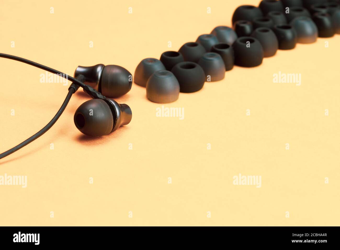 Earphones with row of ear cushions. in-ear headphones with many ...