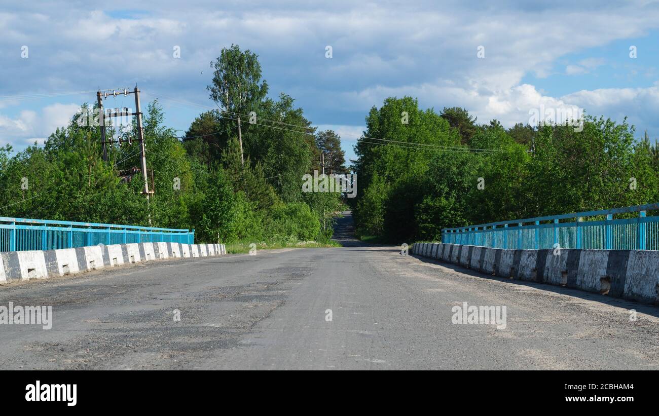 Bridge in the countryside. rural landscape. summer day. country road in ...
