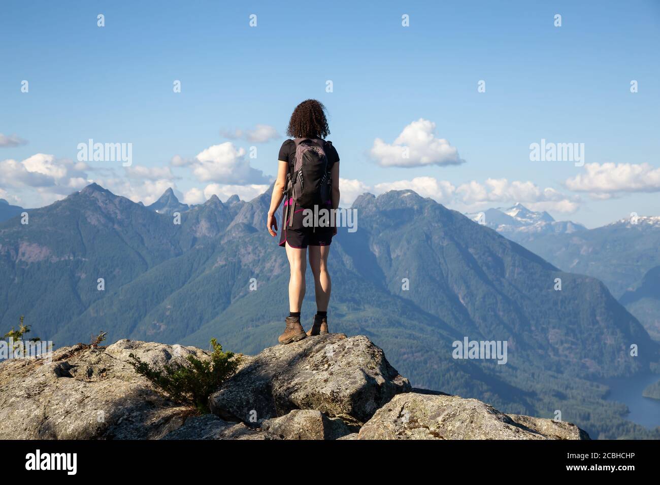 Adventurous Girl Hiking on top of Tin Hat Mountain Stock Photo - Alamy