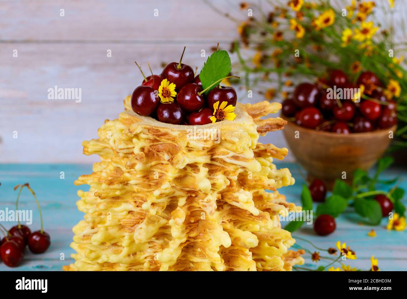 lithuanian spit cake sakotis decorated with fresh cherries Stock Photo ...