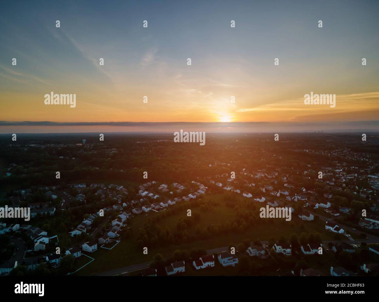 Colorful sky during sunset landscape scenic aerial view of a suburban ...