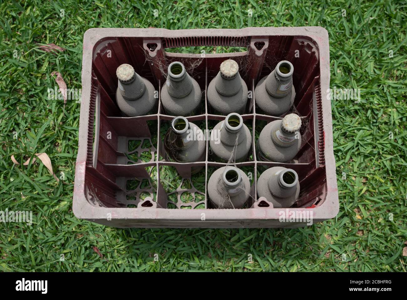 Top view of an old red plastic box full of covered in dust empty ...