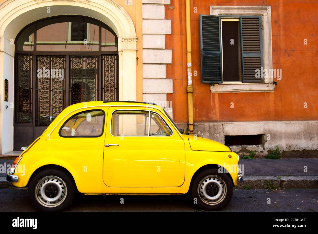 Urban scene in Rome with old italian car Stock Photo - Alamy