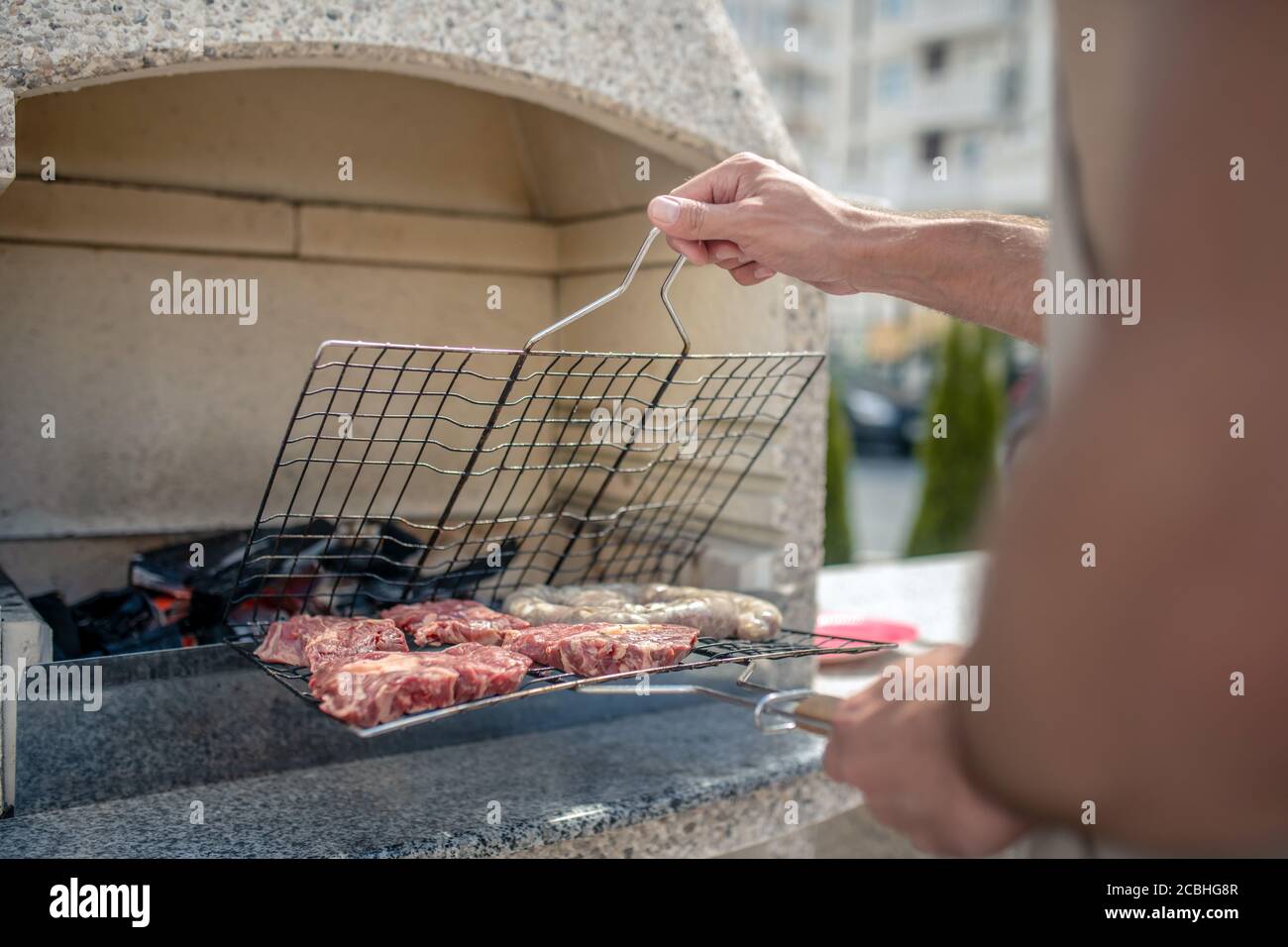Preparing grill hi-res stock photography and images - Alamy