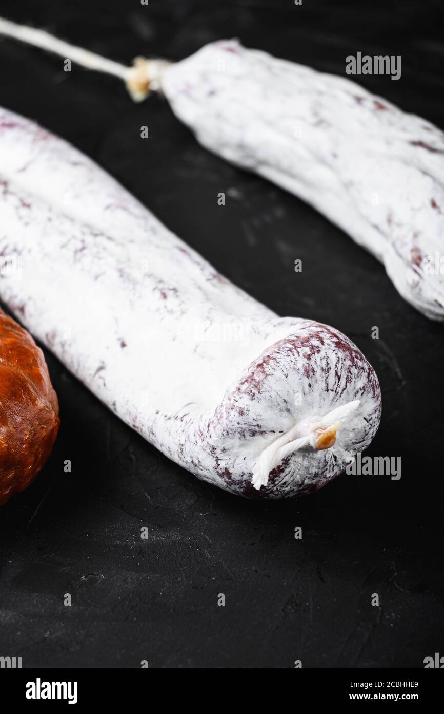 Traditional spanish sausages fuet and chorizo on black background Stock ...