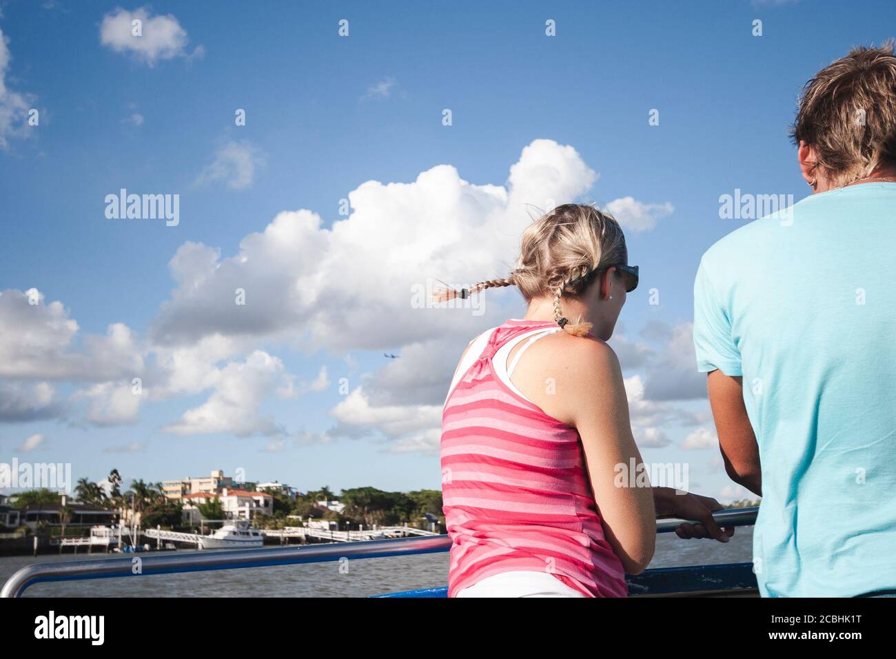 Rear view of a couple in sailing boat, Brisbane river Stock Photo - Alamy