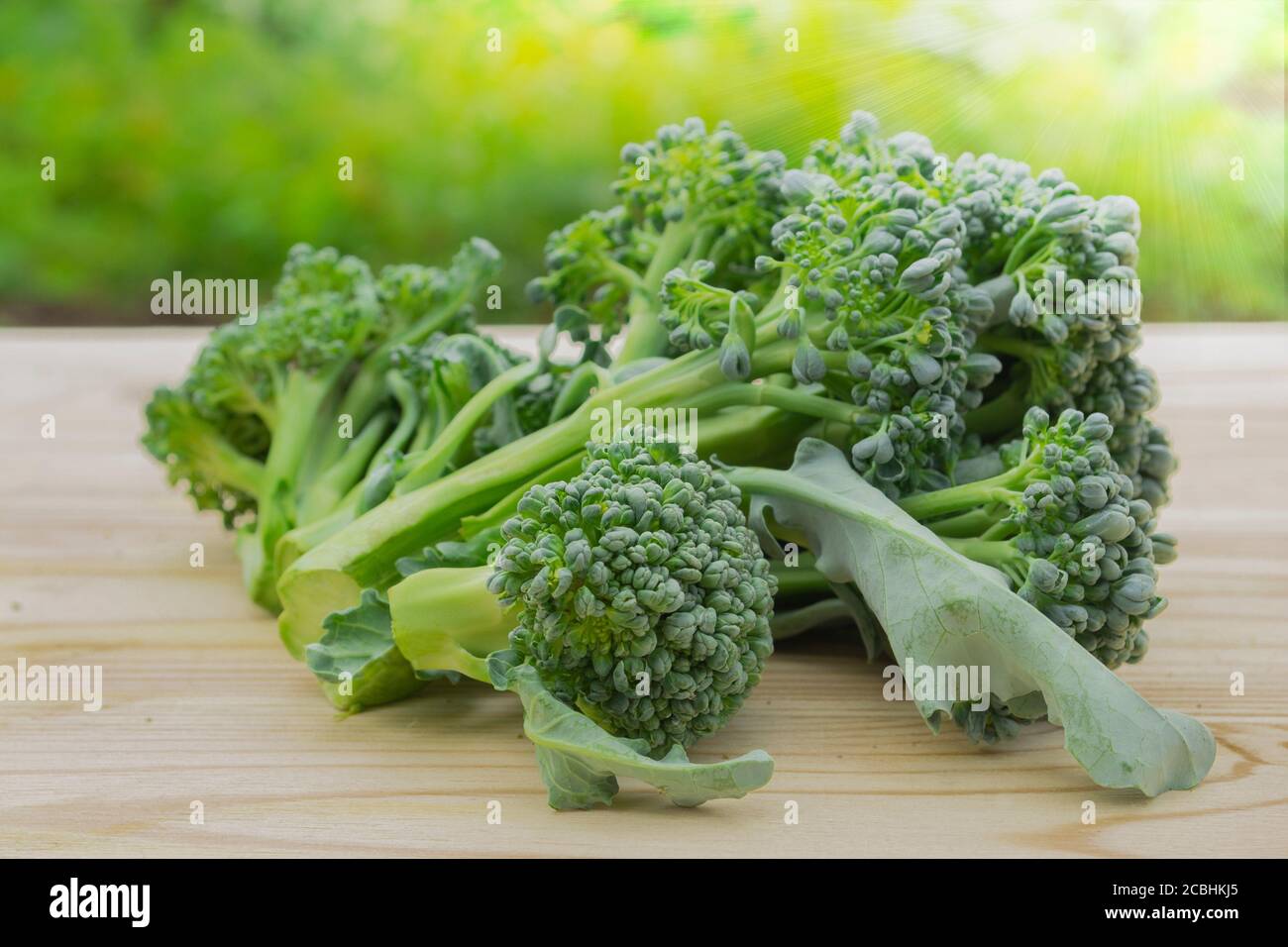 Broccoli cabbage on a light wooden Stock Photo - Alamy