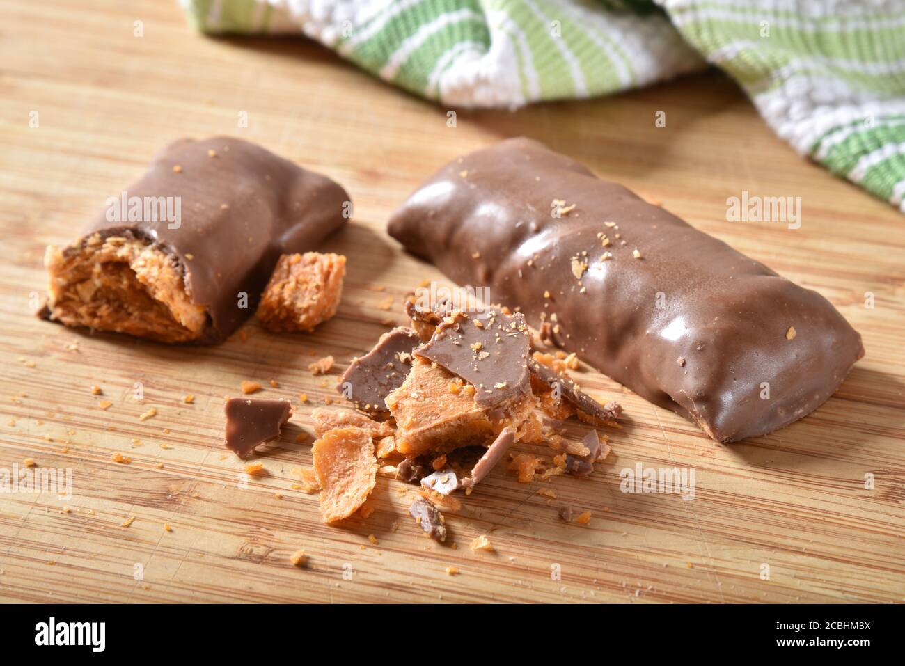 A butter crunch candy bar on a wooden cutting board Stock Photo - Alamy
