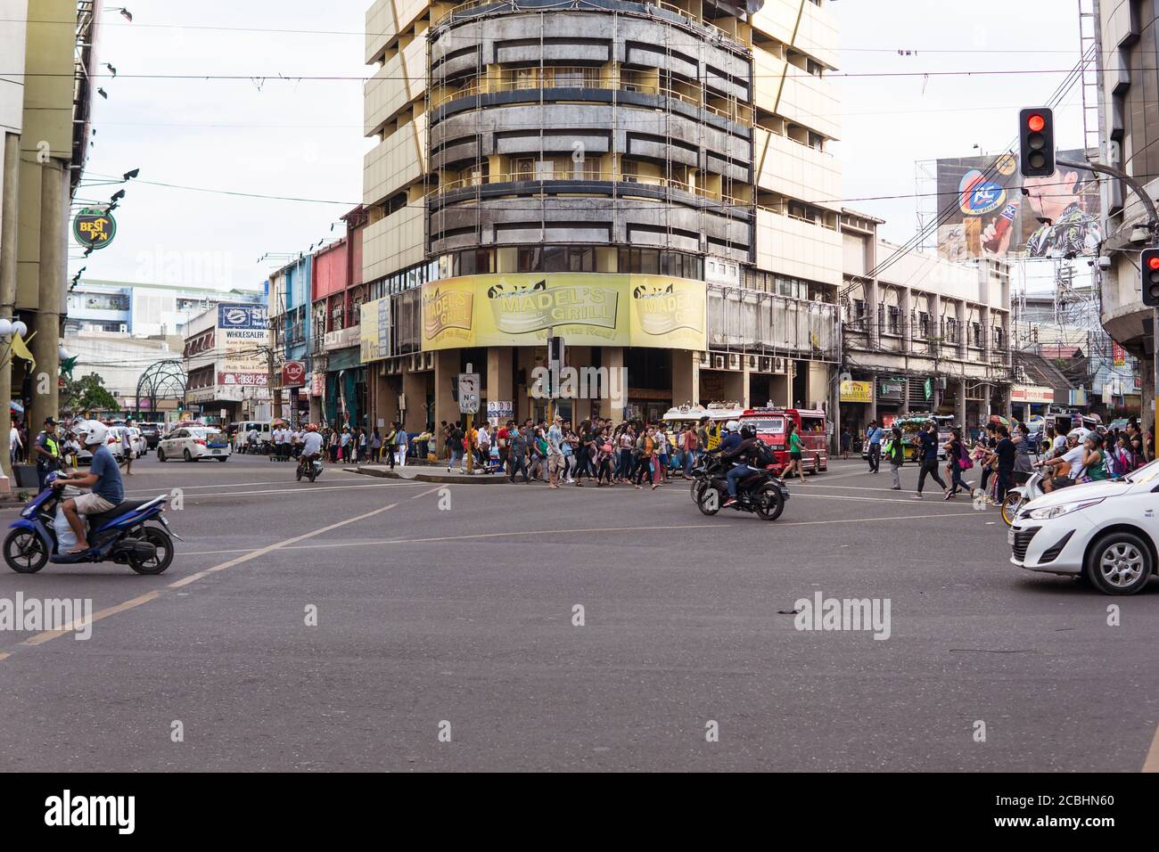 Cebu / Philippines - July 10, 2019: Filipino people crossing busy ...