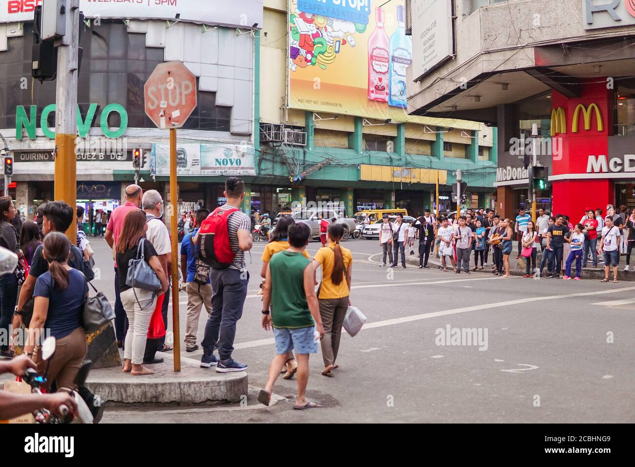 Cebu / Philippines - July 10, 2019: Filipino people crossing busy ...