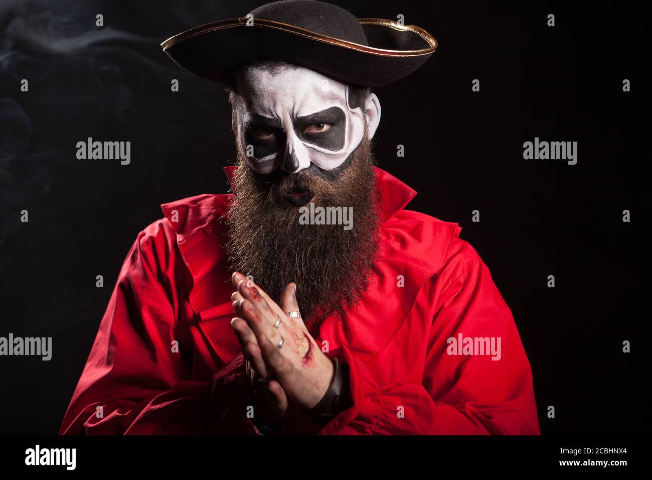 Man dressed up like a scary pirate for halloween celebration over black ...