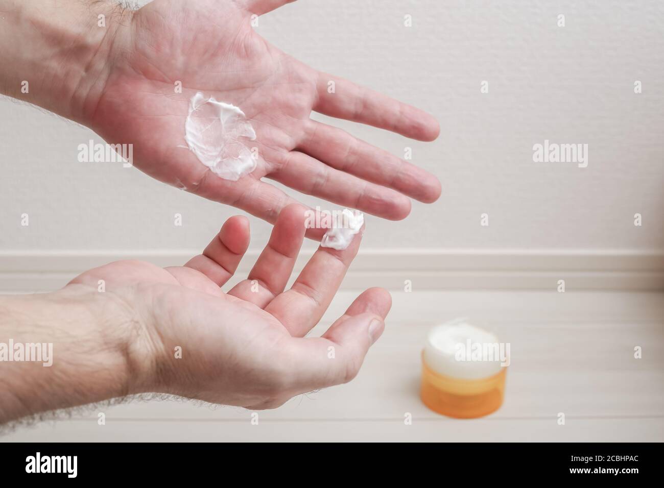 Tokyo, Japan, 08/14/2020 , man applying hand cream on his hands Stock ...