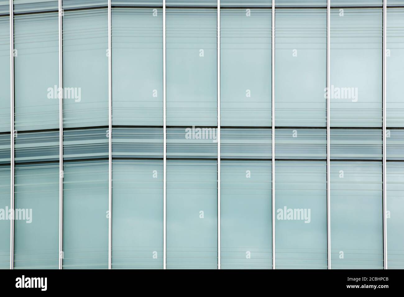 Modern glass wall office building Stock Photo - Alamy