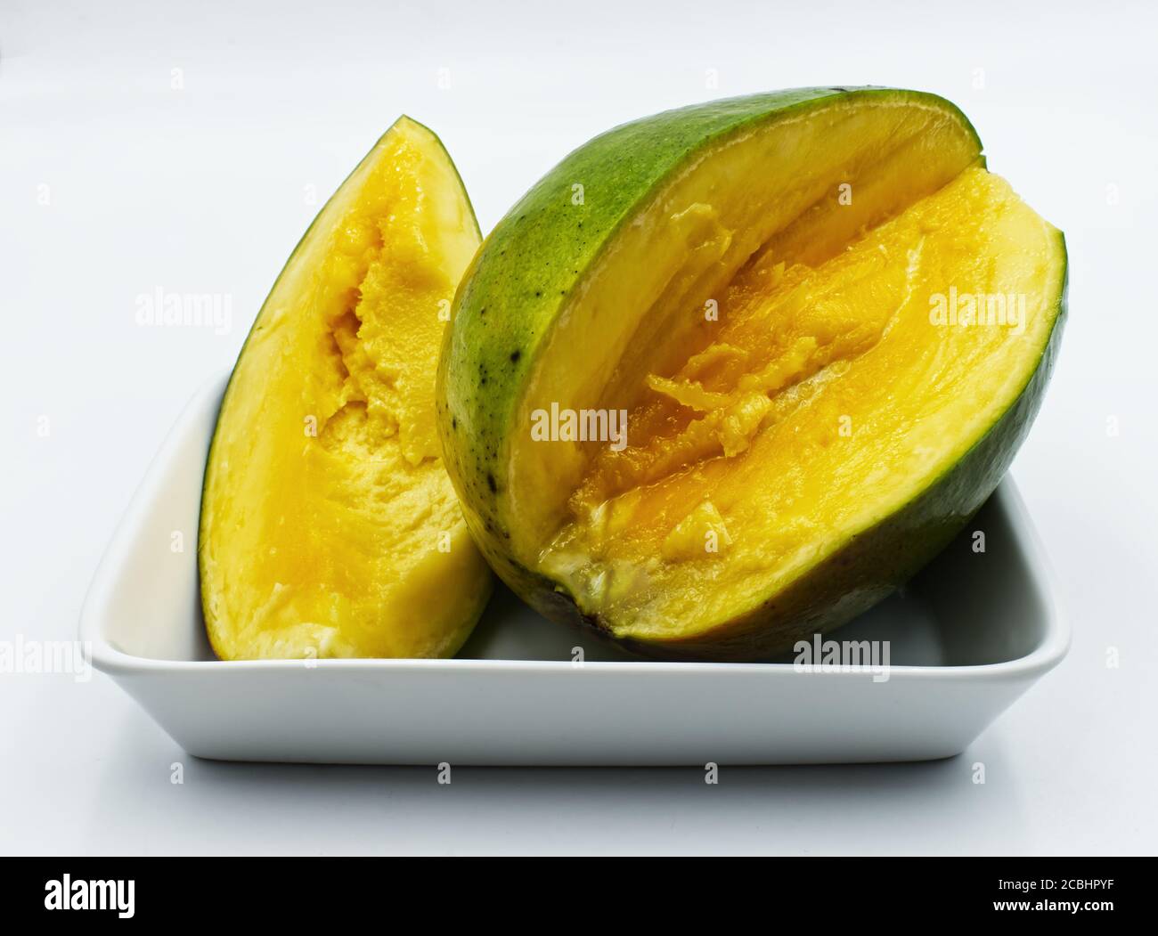 Mango isolated on white background. Studio shot Stock Photo - Alamy