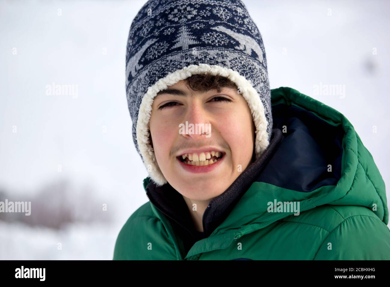 Portrait of happy boy in the snow Stock Photo - Alamy