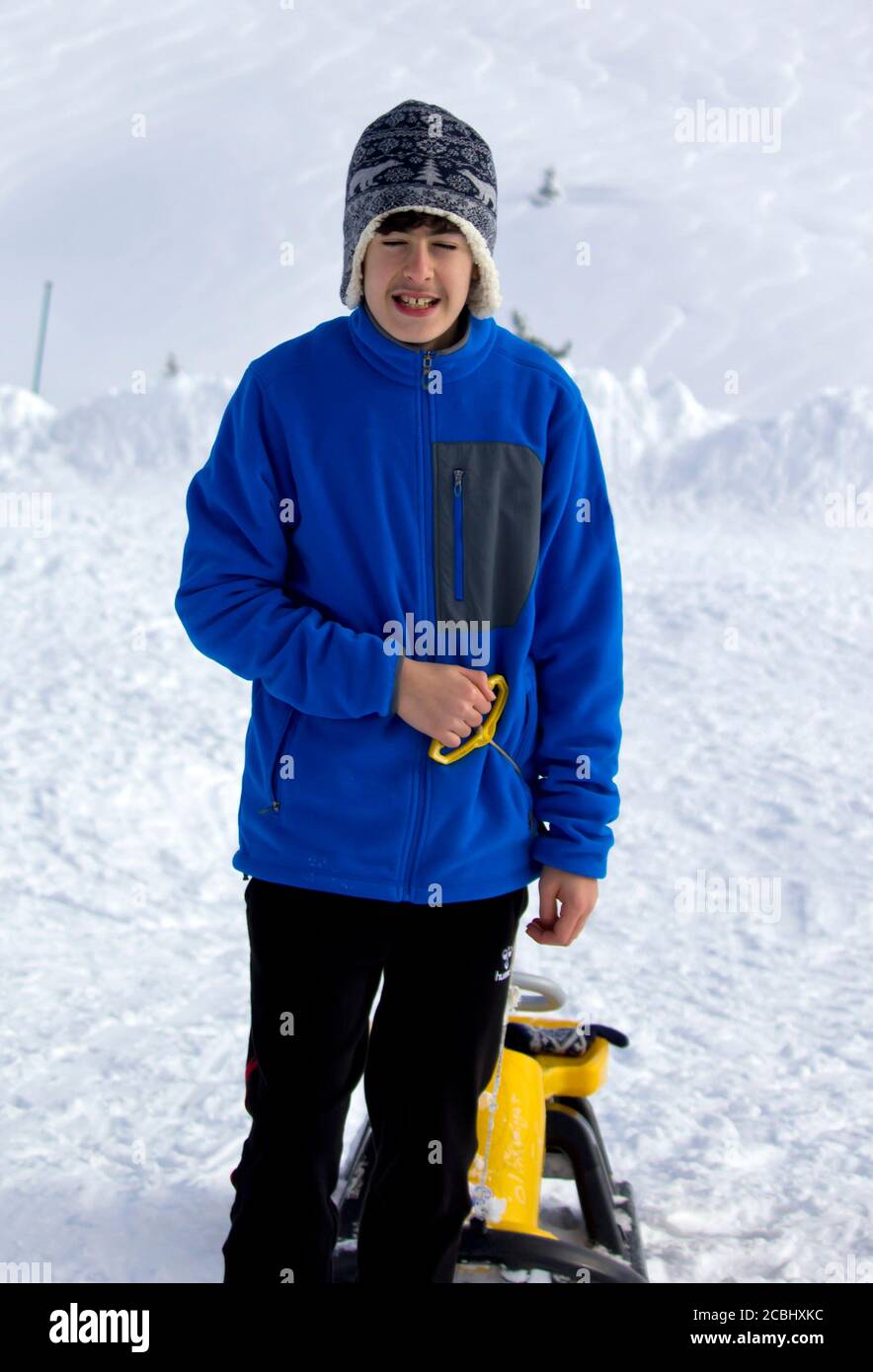 Portrait of happy boy in the snow Stock Photo - Alamy
