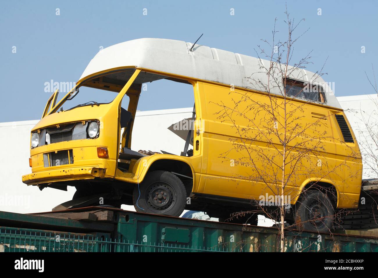 Yellow VW bus post bus on a scrap yard, Germany Stock Photo - Alamy