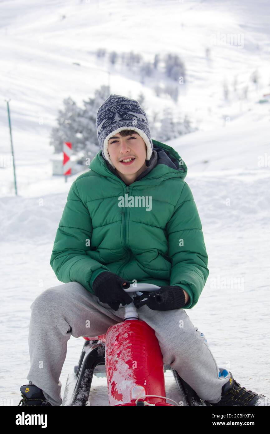 Portrait of happy boy in the snow Stock Photo - Alamy