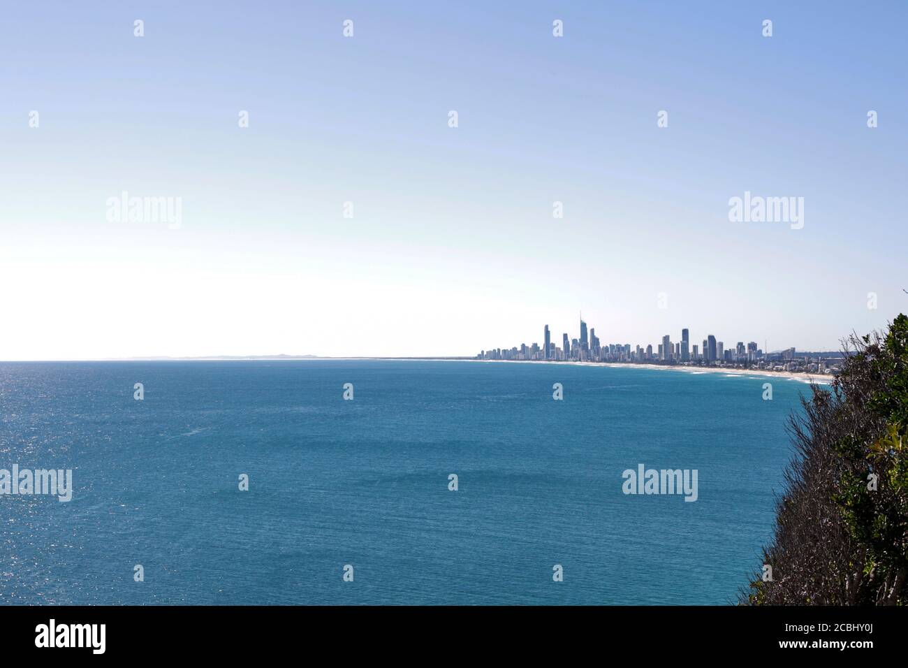 Scenic view of sea and big city against sky Stock Photo - Alamy